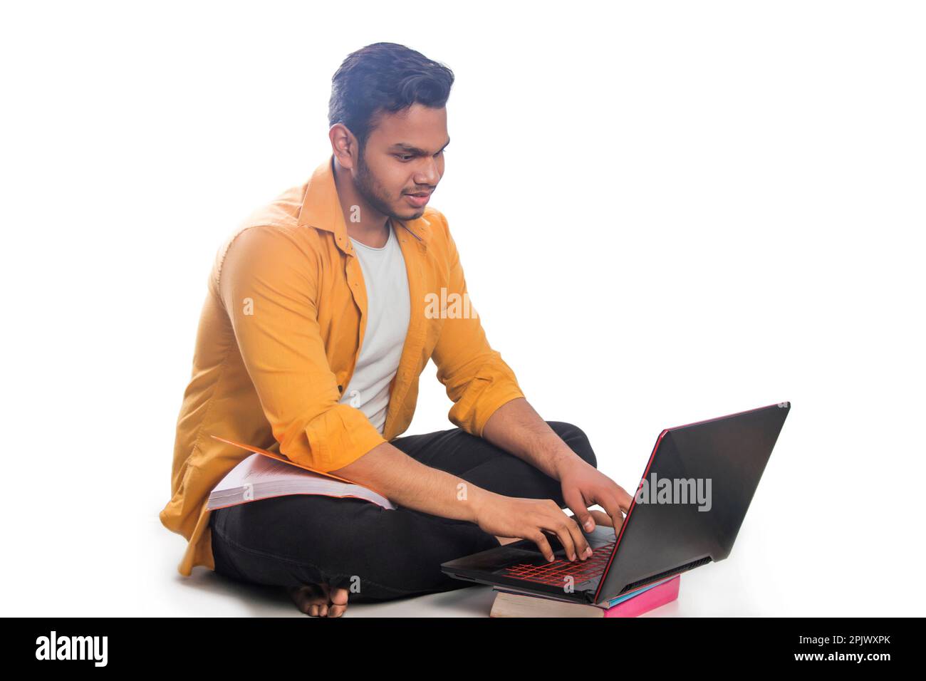College student with a laptop while ATTENDING ONLINE CLASS Stock Photo ...