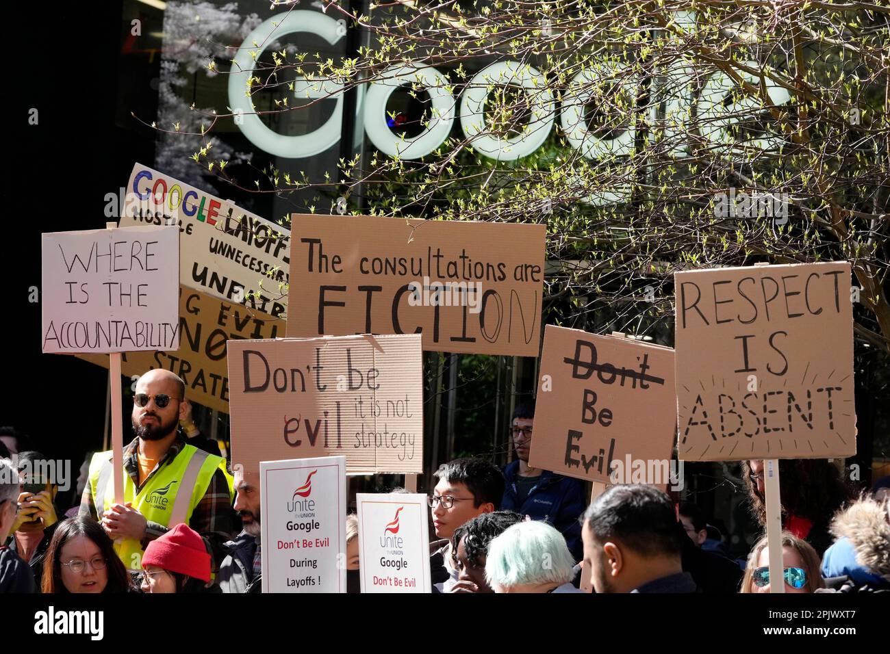 Google employees hold signs during a protest outside Google ...