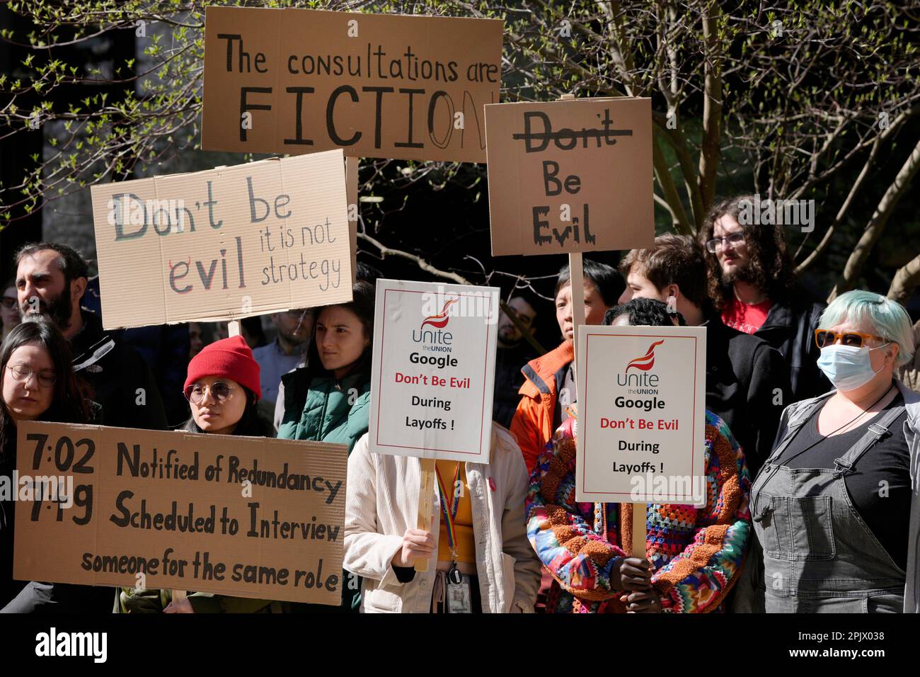 Google employees hold signs during a protest outside Google ...