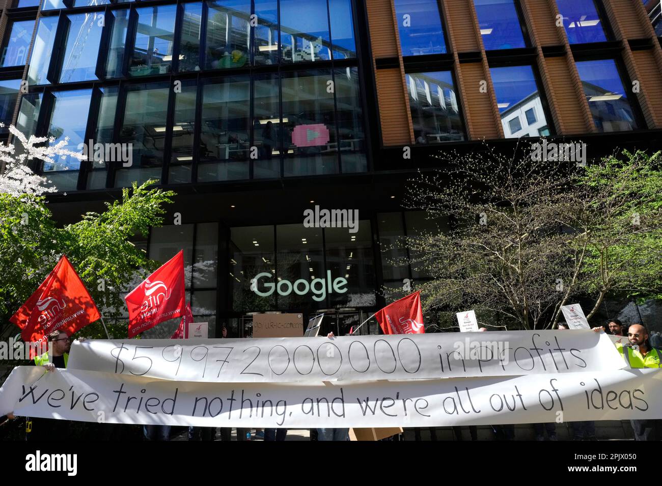 Google employees hold signs during a protest outside Google ...