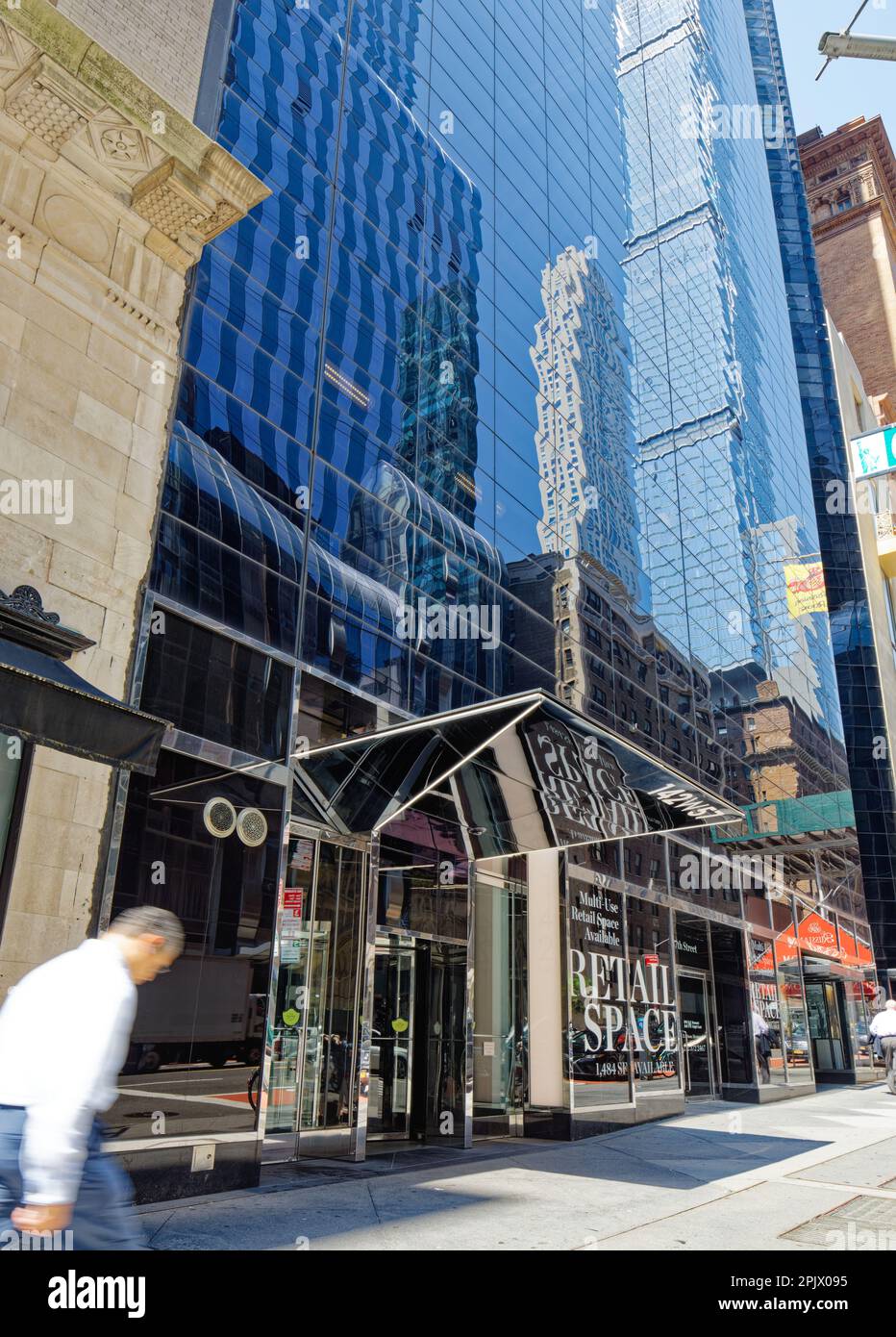 Metropolitan Tower has a reflective, minimalist black glass face to ...