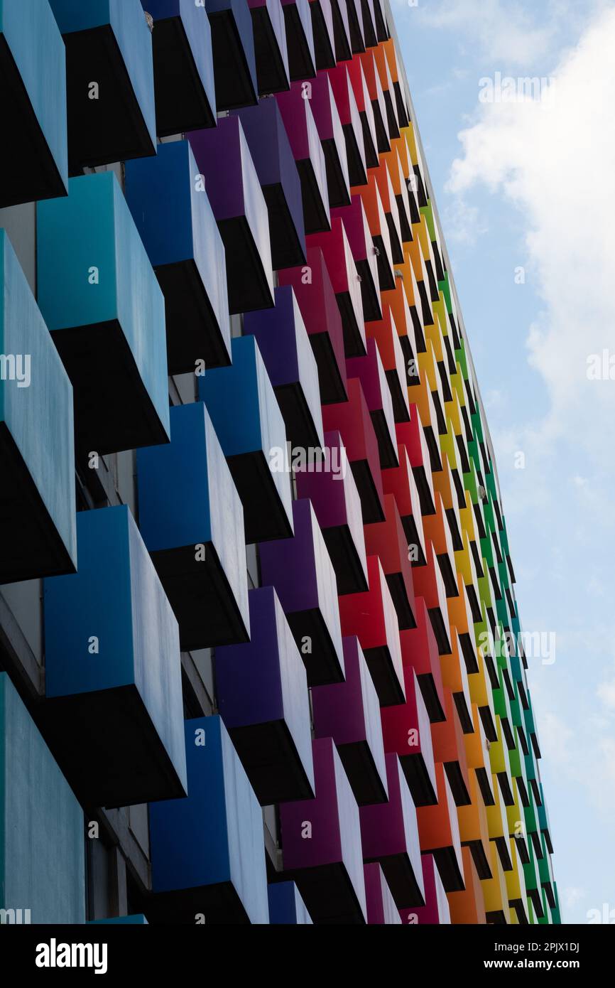 A view looking up a multi colored building from the street Stock Photo ...