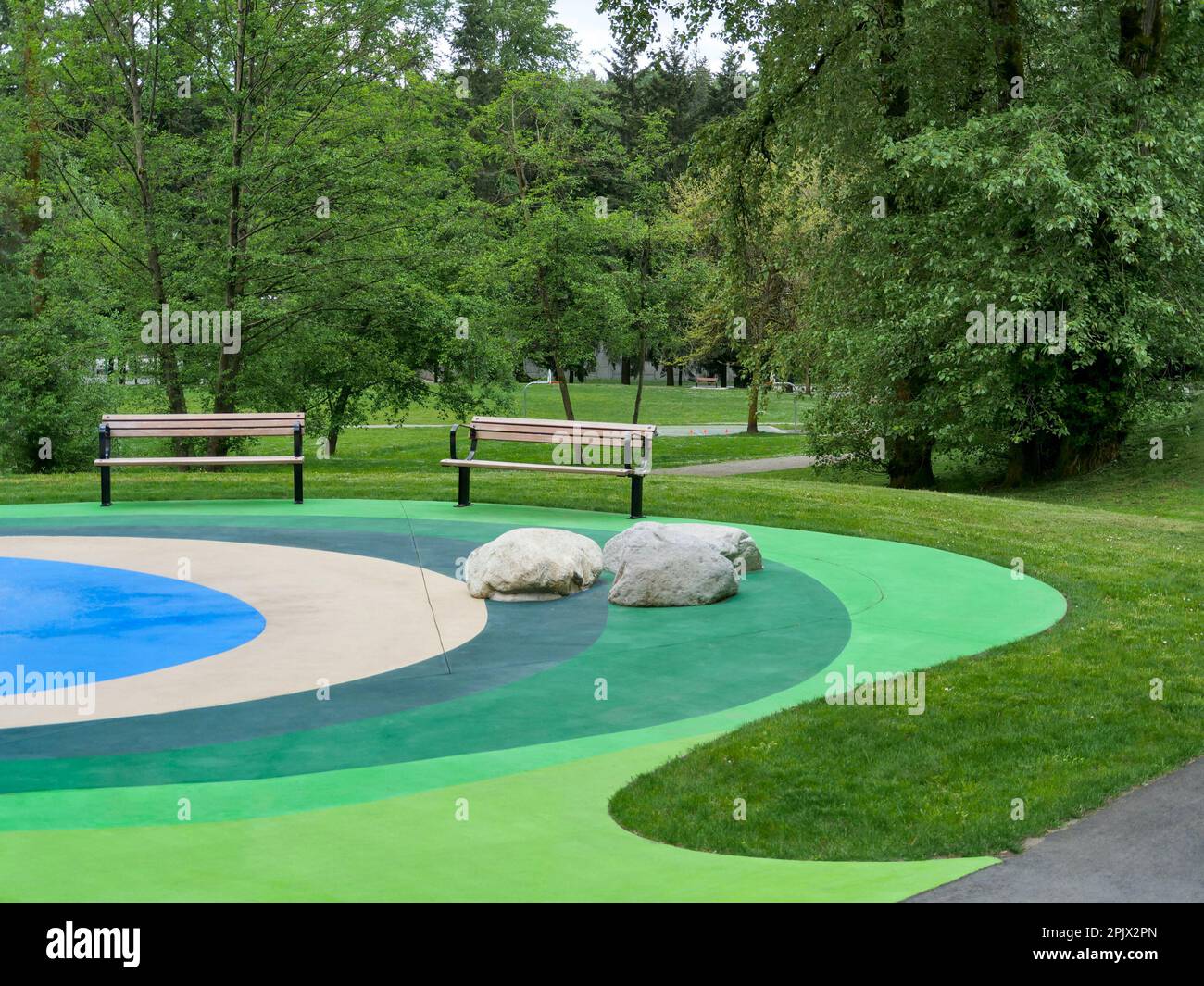 Recreational area in a park with two benches on colored ground Stock ...