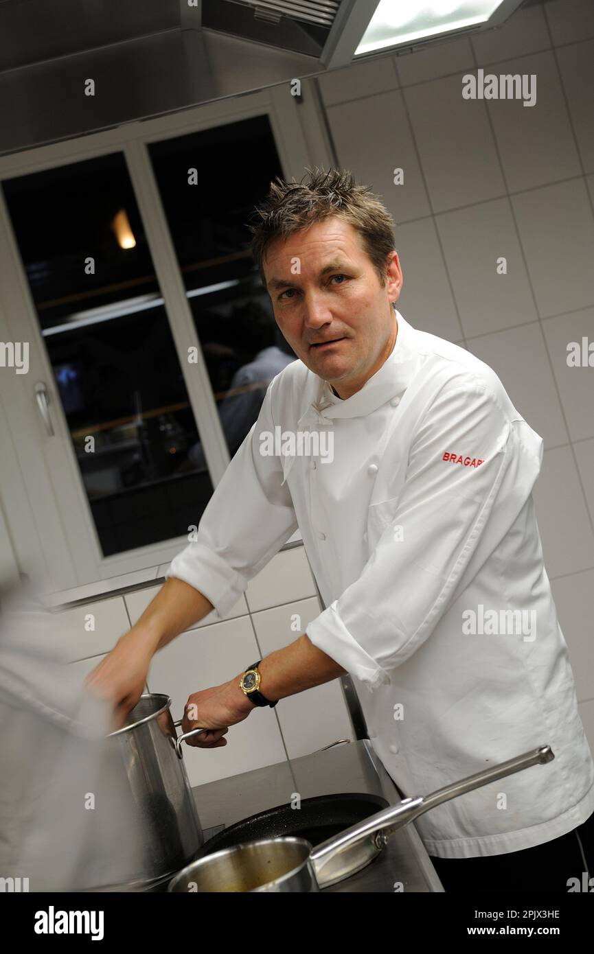 Chef Daniel Bumann in the kitchen of the restaurant Chesa Pirani La ...
