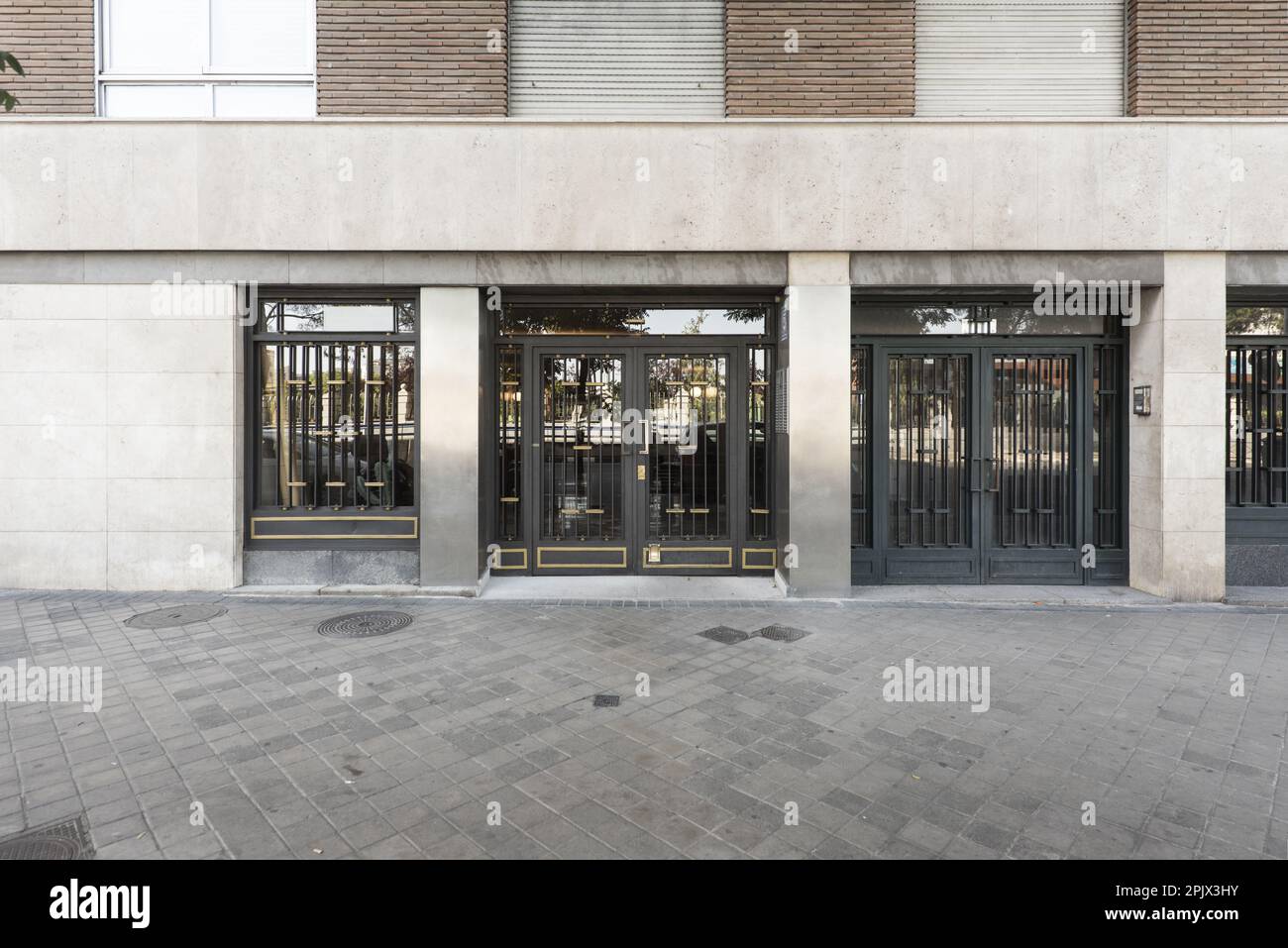 Exterior portal to the street of a simple residential building with ...