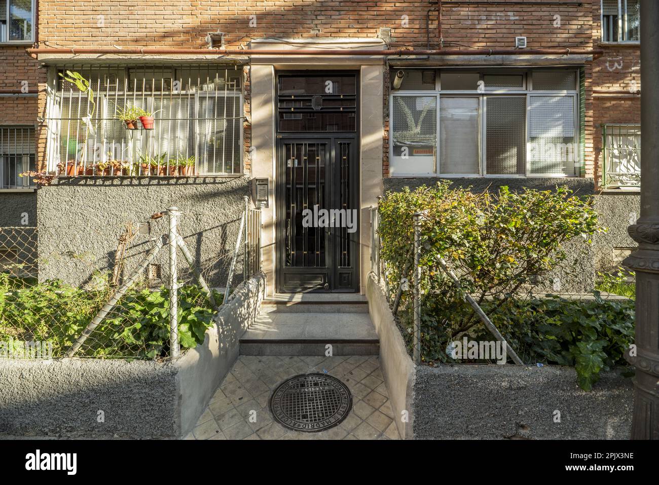 Access portal from the street to a residential building of modest ...