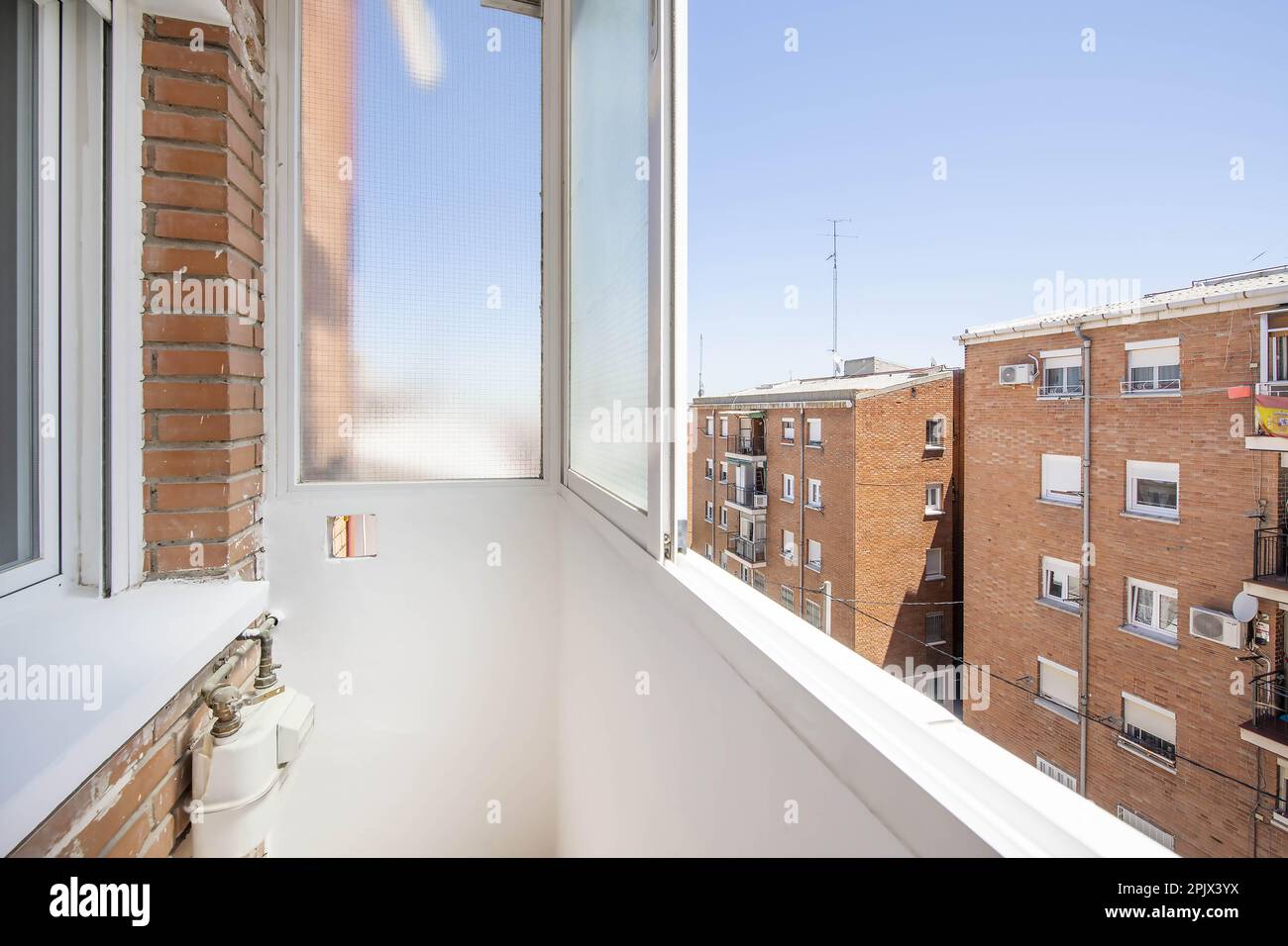 Small viewing terrace of a house with white aluminum sliding windows ...