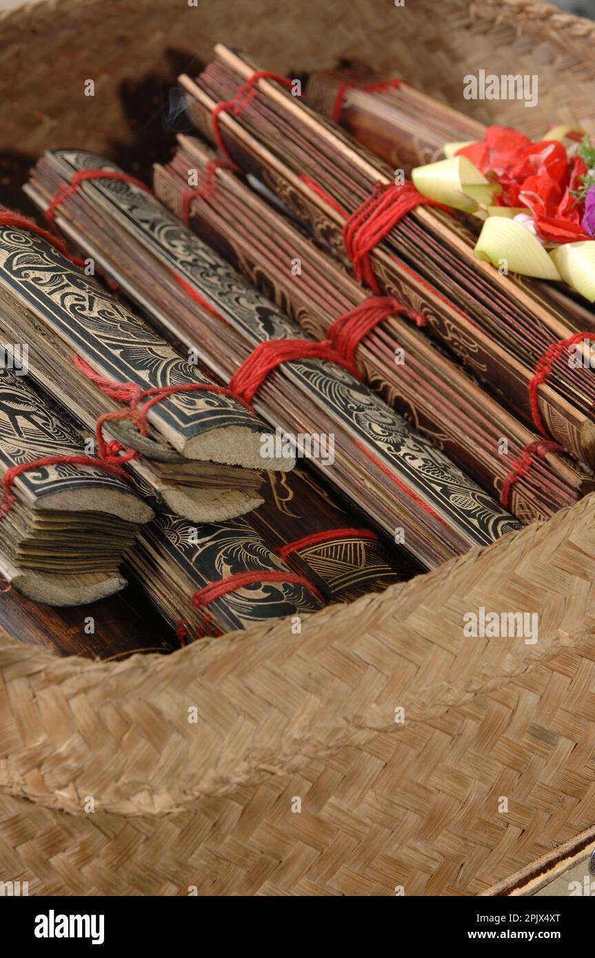 Traditional calligraphy on dried palm leaf at Tenganan village in East ...