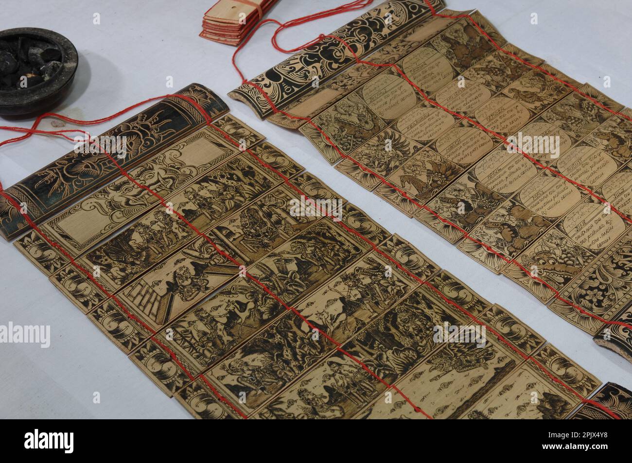 Traditional calligraphy on dried palm leaf at Tenganan village in East ...