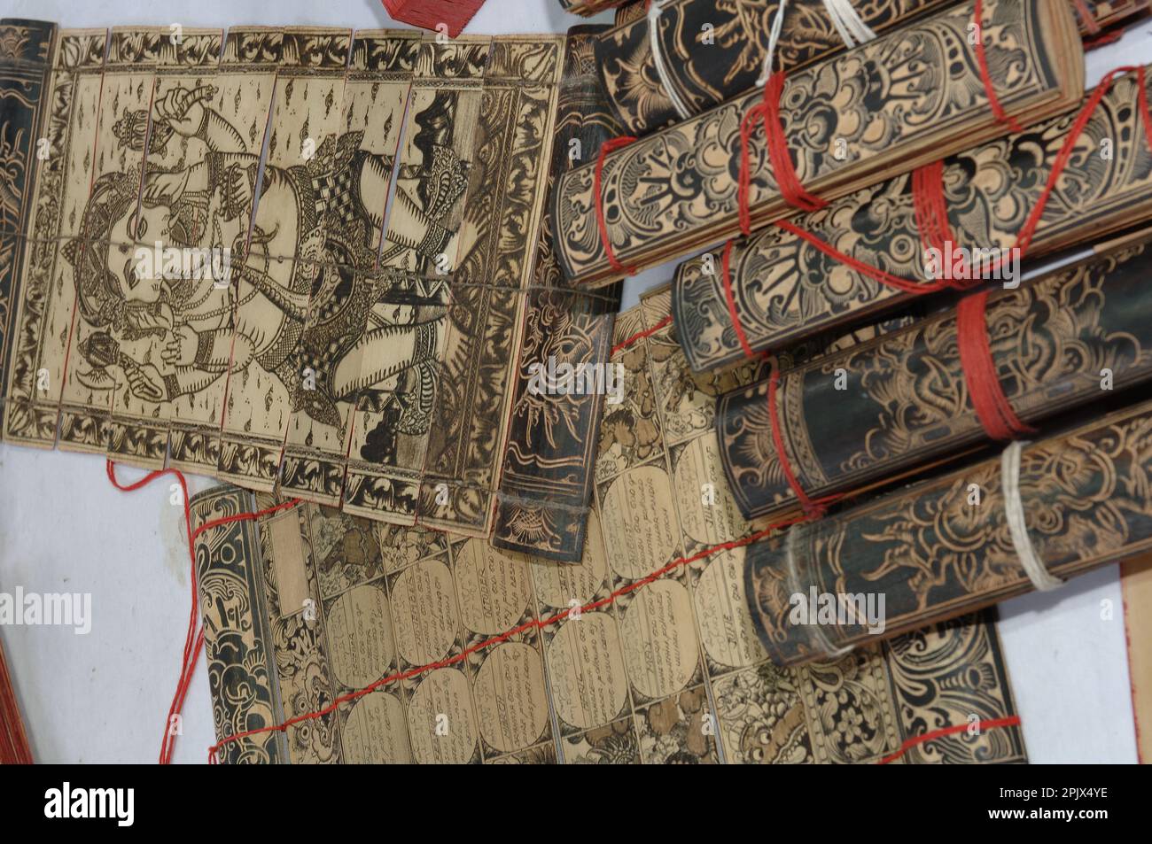 Traditional calligraphy on dried palm leaf at Tenganan village in East ...