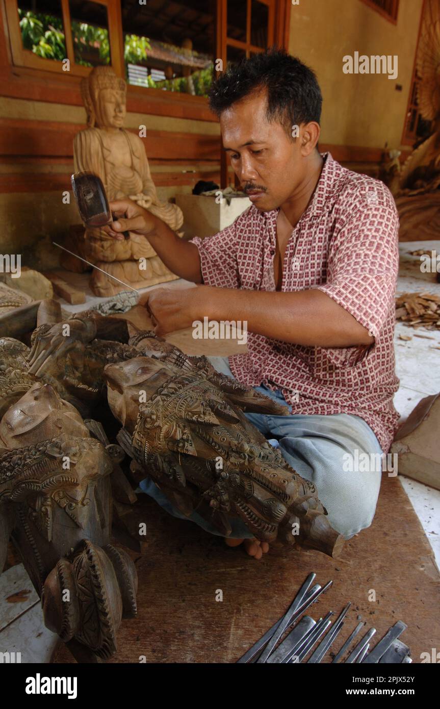 carving of traditional wooden statues in the Bagus Marka Gallery wood ...