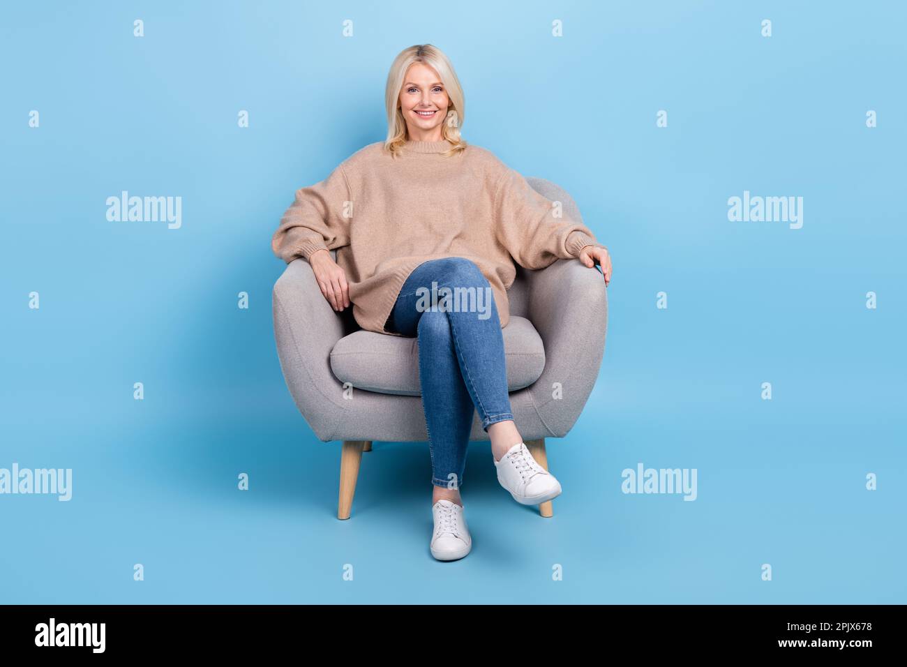 Full length photo of cheerful aged person sit comfy chair good mood ...