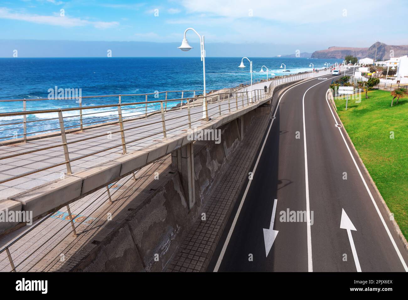 Highway along the ocean coast . Pedestrian bridge and coastal road ...