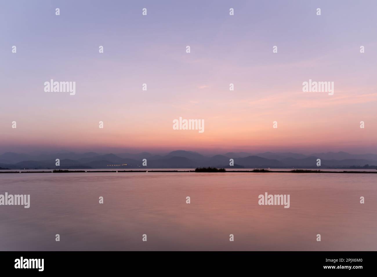 Beautiful sunrise above water mountain in dam Stock Photo - Alamy