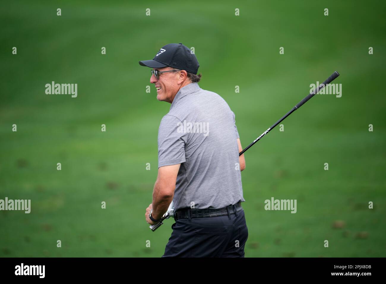 Phil Mickelson works out on the range during a practice for the Masters ...