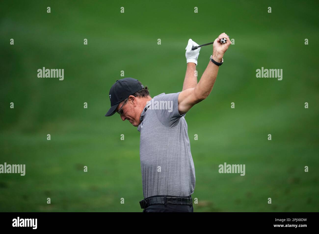 Phil Mickelson works out on the range during a practice for the Masters ...