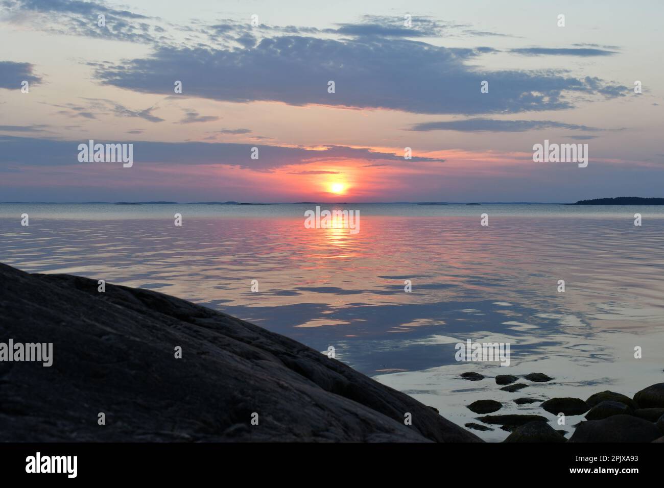 Calm sea on August evening in the archipelago in Finland Stock Photo ...