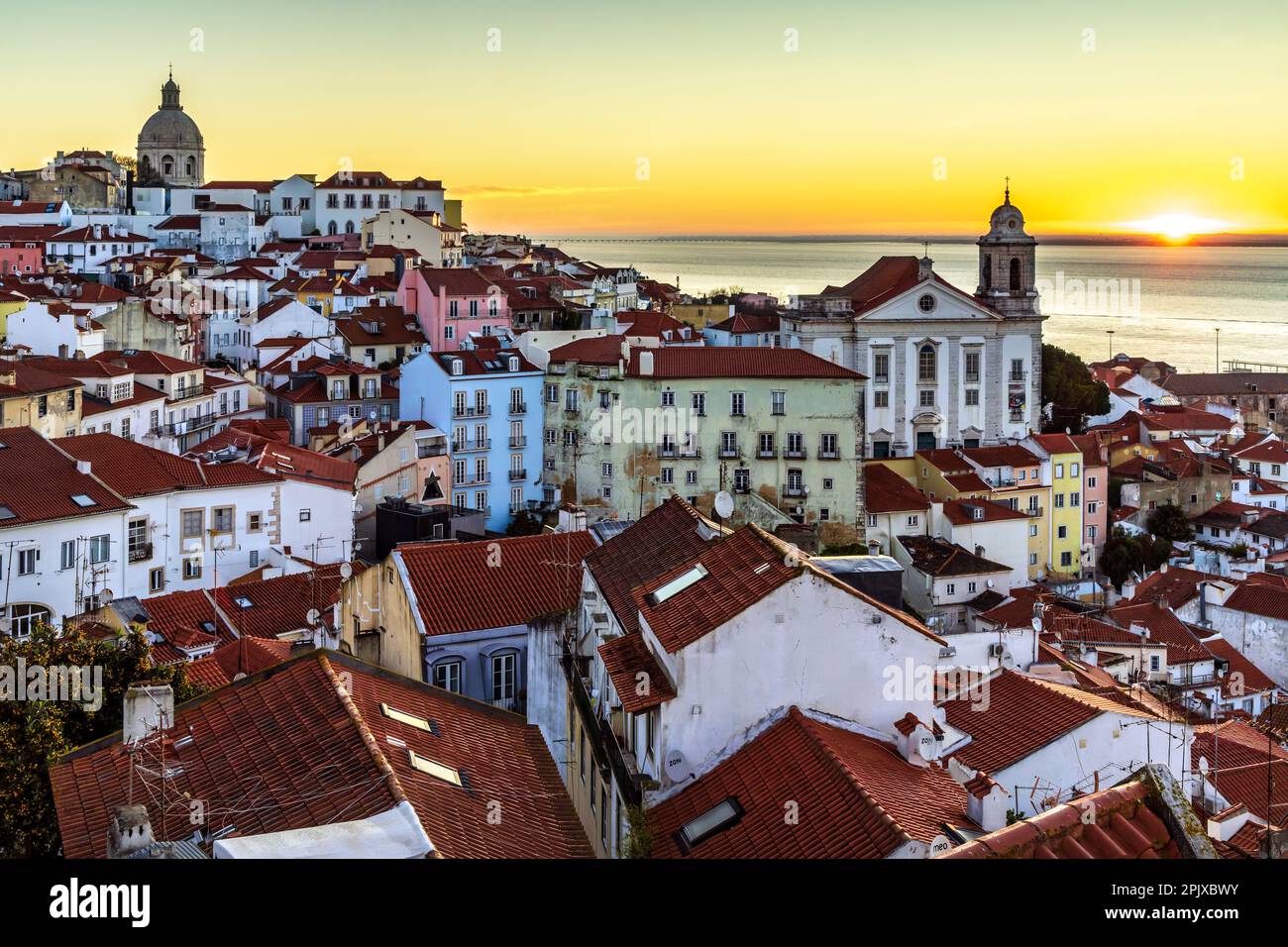 Alfama old town district at sunrise viewed from Miradouro das Portas do ...