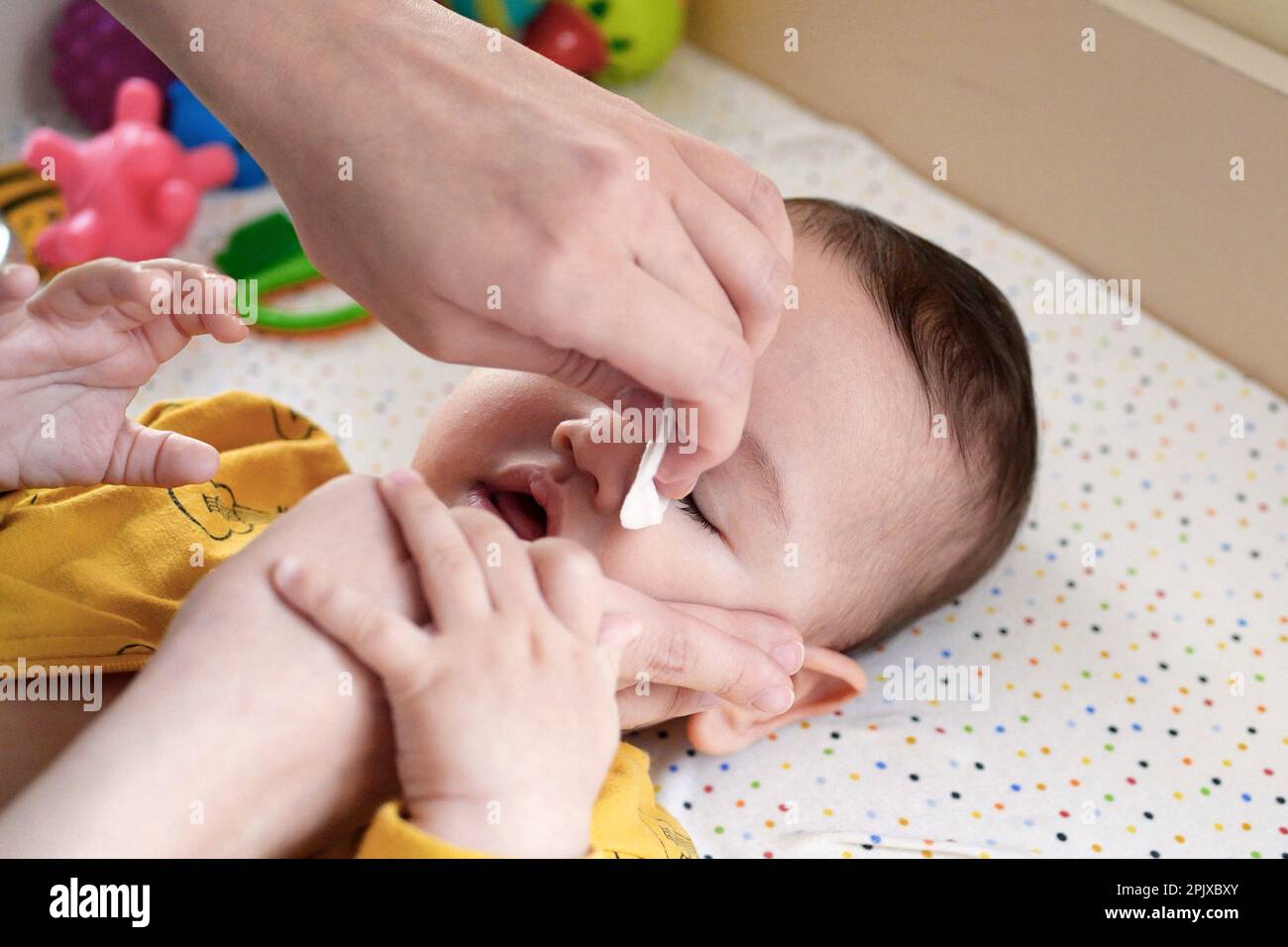 babies and newborn hygiene and healthcare. Closeup of cleaning and ...