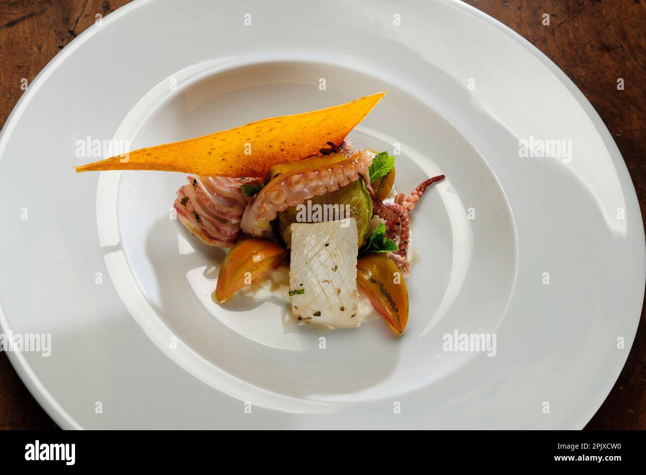 Grilled octopus and cuttlefish with potato chips by Chef Ciccio Sultano ...