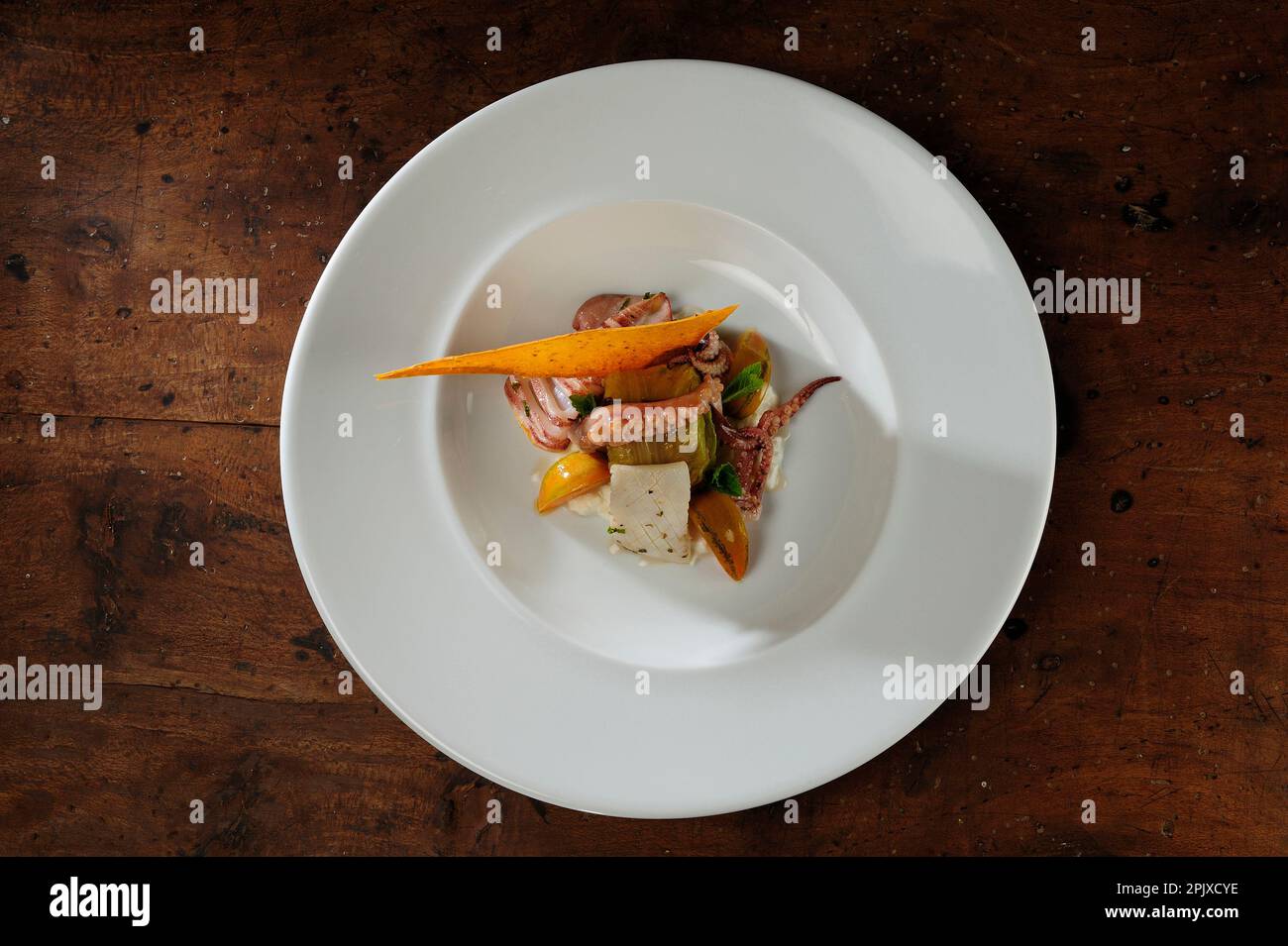 Grilled octopus and cuttlefish with potato chips by Chef Ciccio Sultano ...