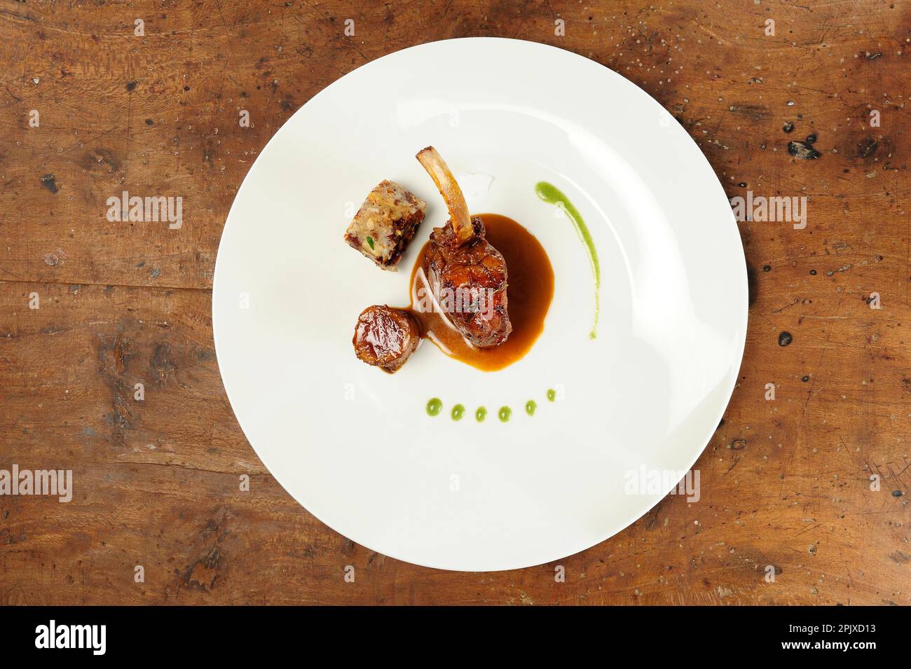 Lamb ribs by Chef Ciccio Sultano of the Duomo restaurant, with two ...
