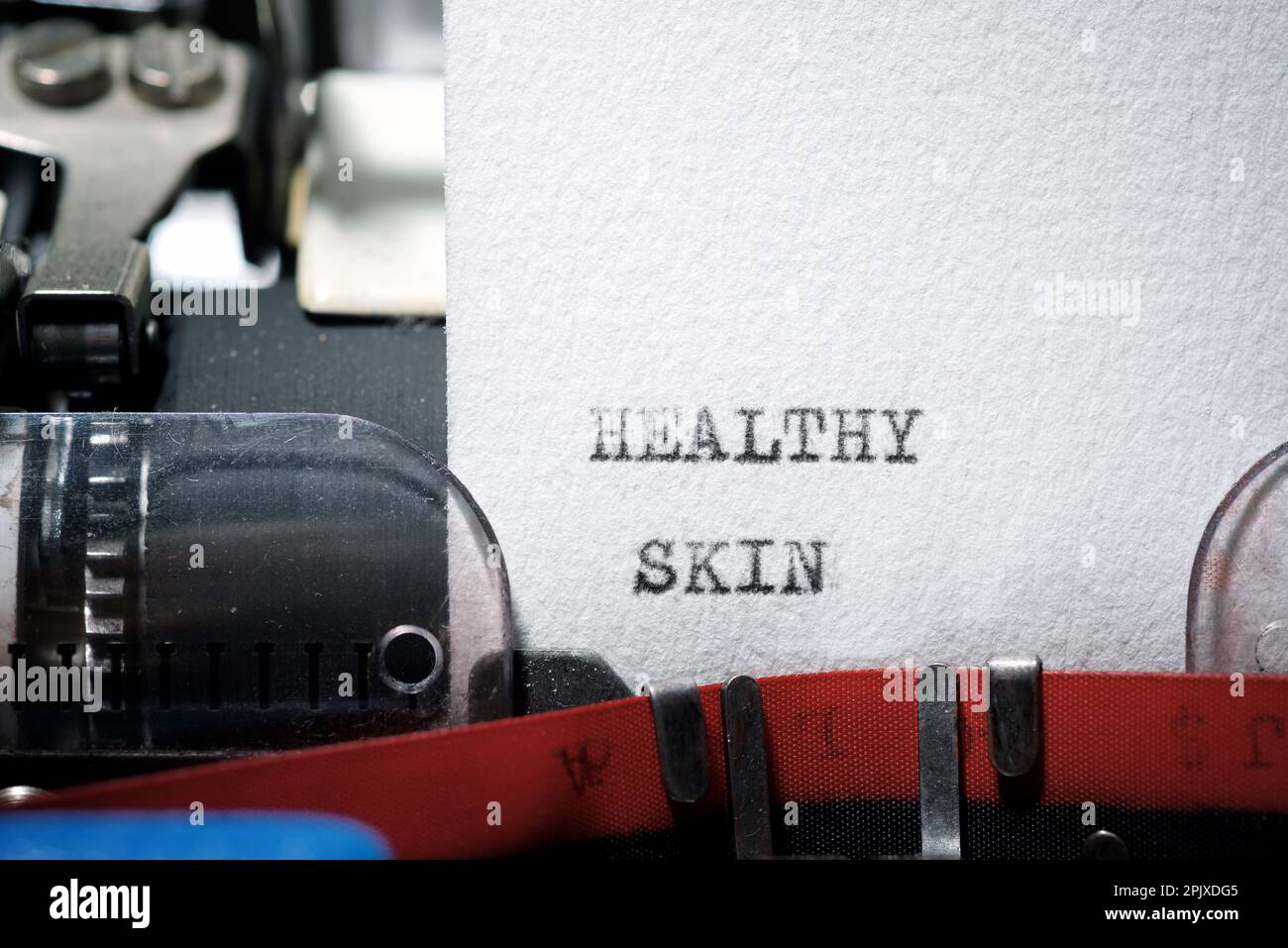 Healthy skin text written with a typewriter Stock Photo - Alamy