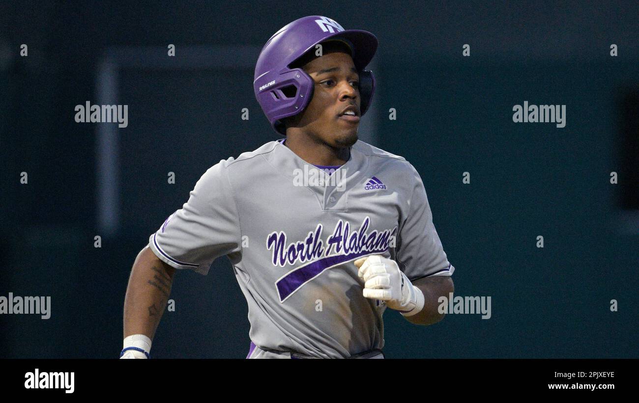 North Alabama's Ethan Walker (16) runs after hitting a pitch during an ...