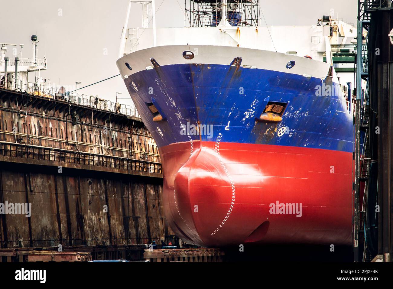 Vessel in a ship repair drydock in the port Stock Photo - Alamy