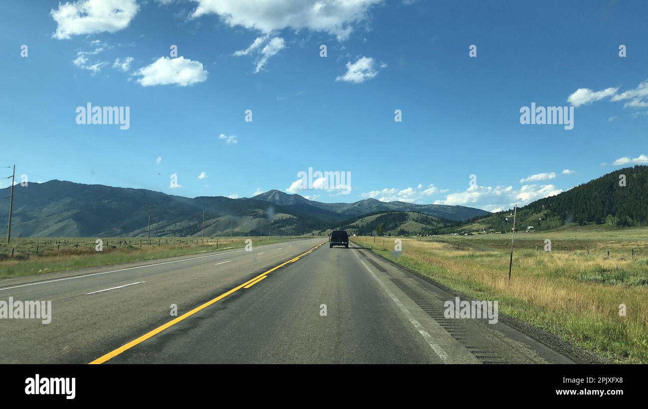 This image features a stunning panoramic view of a mountain range, with ...