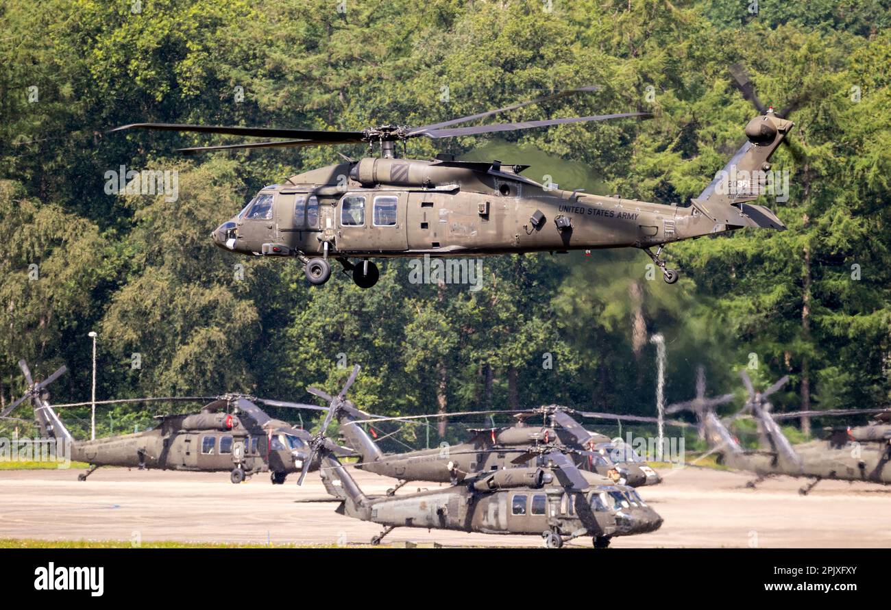 US Army Sikorsky UH-60M Black Hawk helicopters taking off from an air base in The Netherlands ...