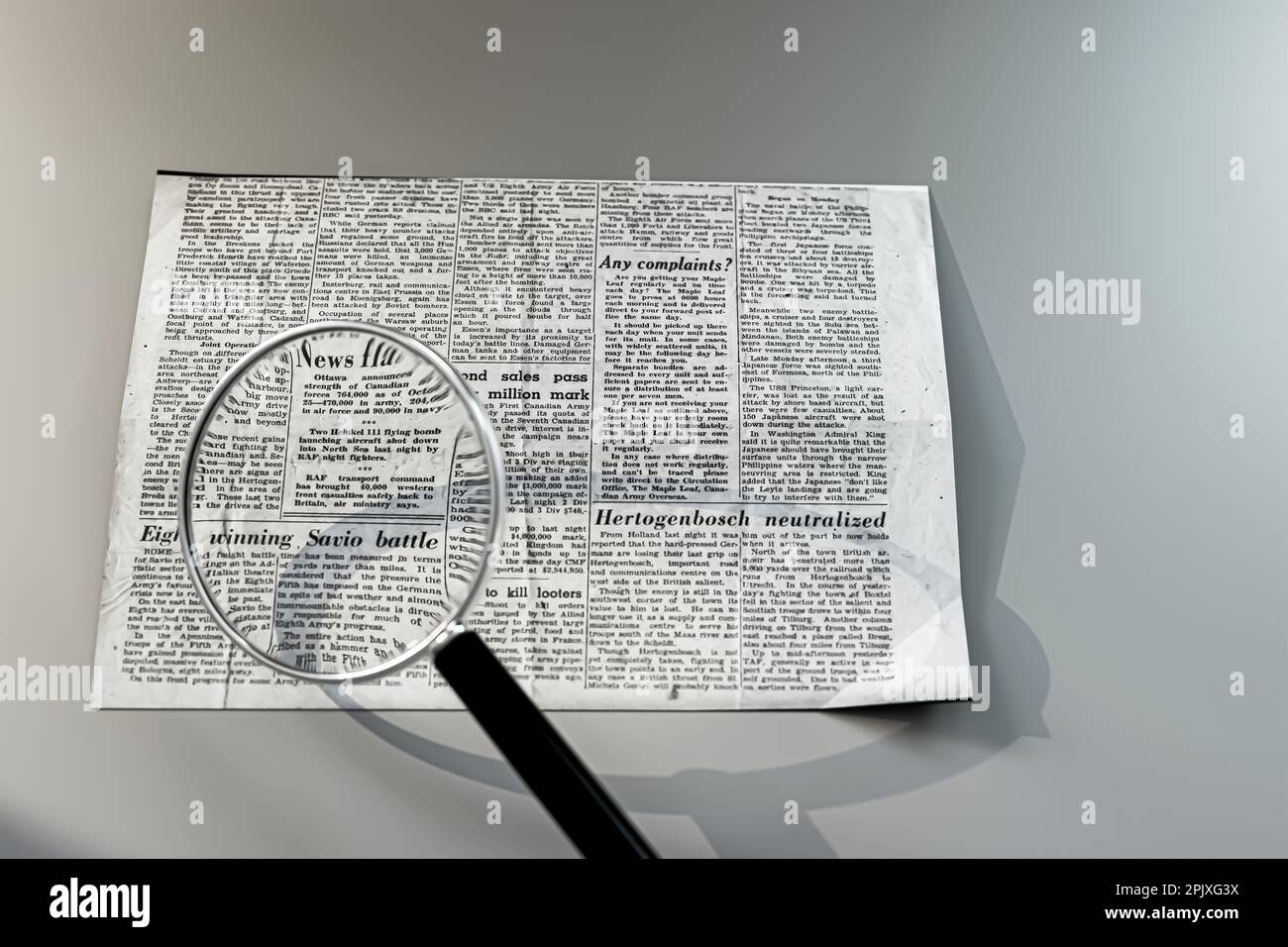 magnifier tool on a newspaper 3d illustration Stock Photo - Alamy