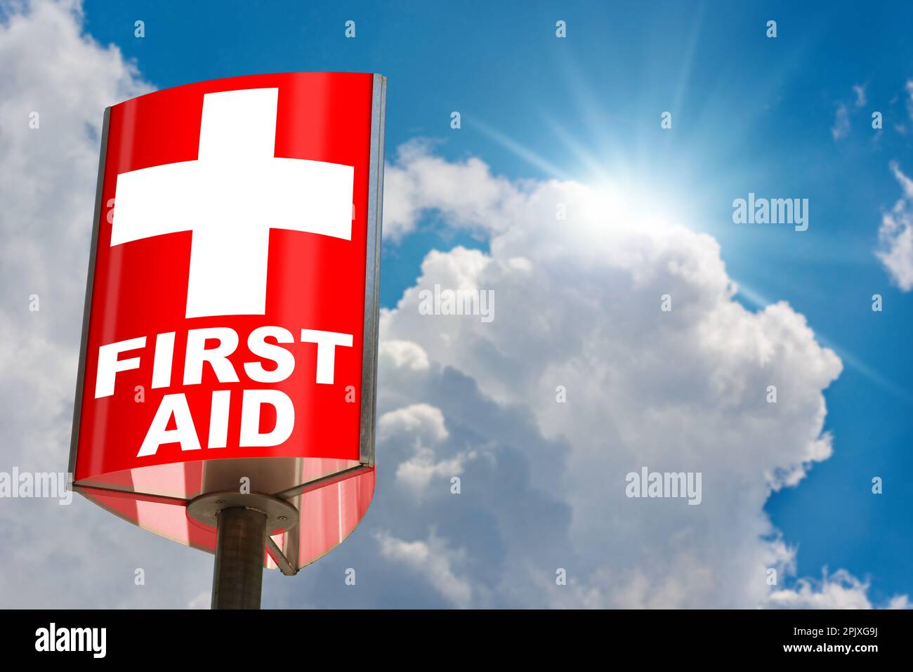 Close-up of a modern red and white First Aid Sign against a clear blue ...