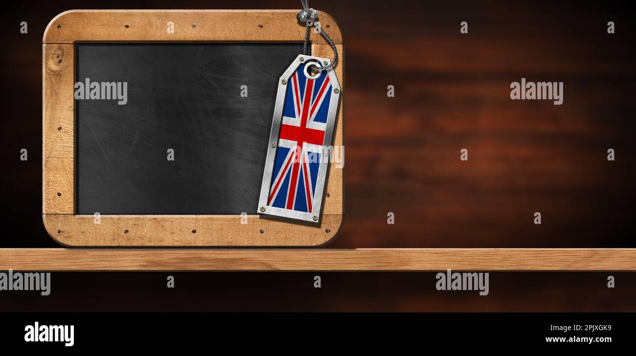 Empty blackboard with wooden frame and copy space, and a metal label ...