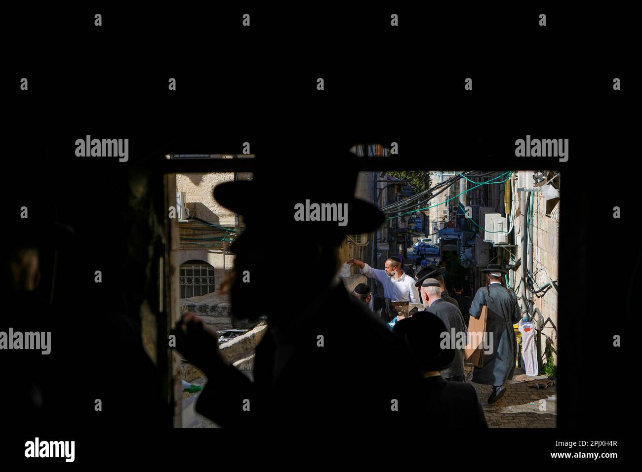 Ultra-orthodox Jewish men dip cooking utensils in boiling water to ...