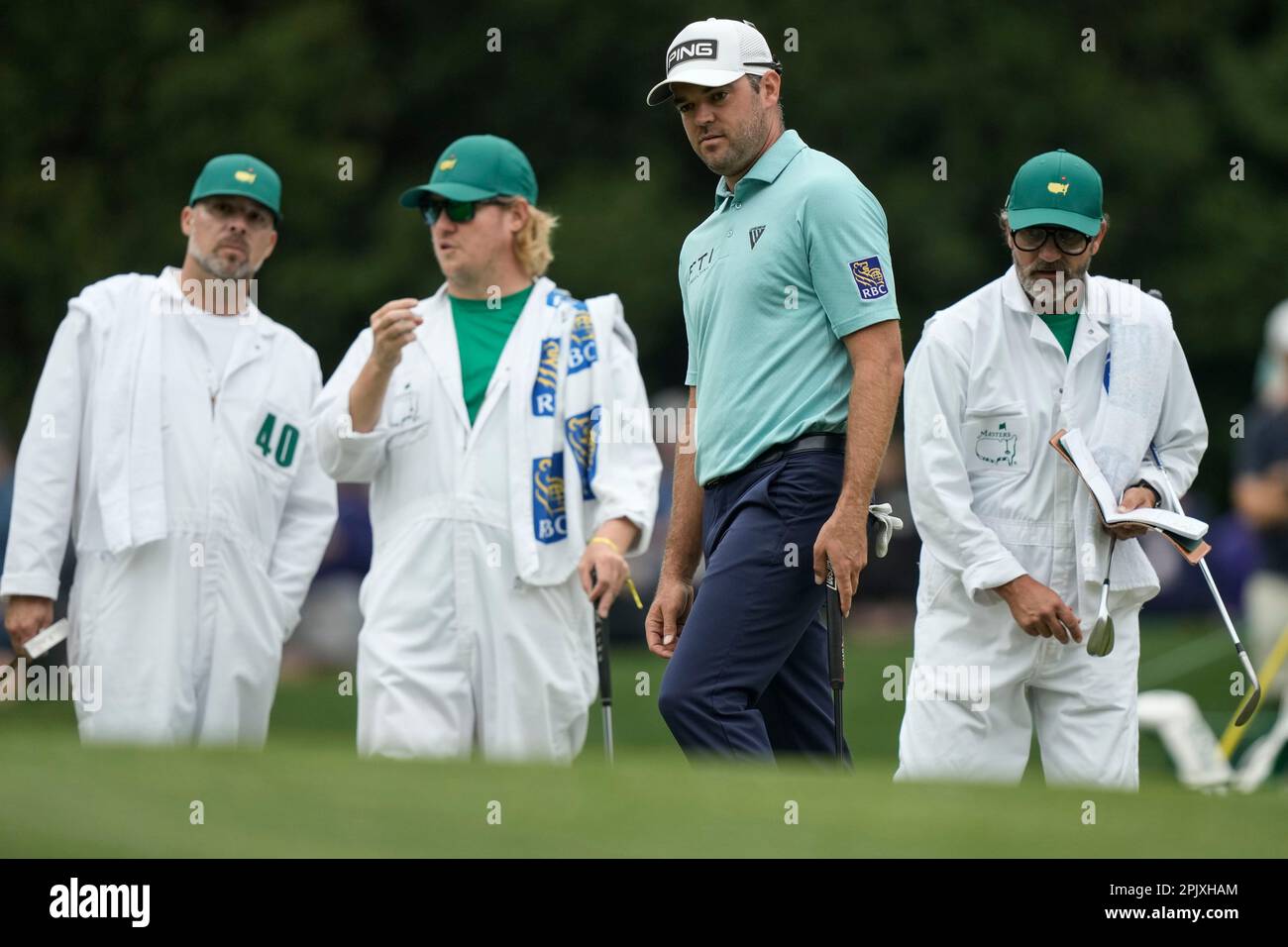 Corey Conners, of Canada, watches his shoit on the third hole during a ...
