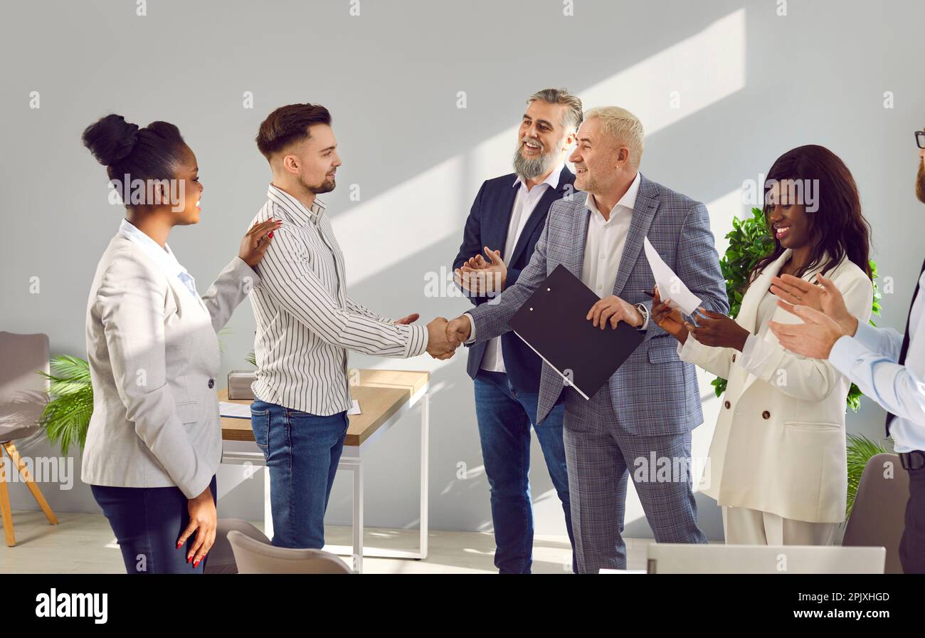 Business group applauding partners during meeting in office Stock Photo - Alamy