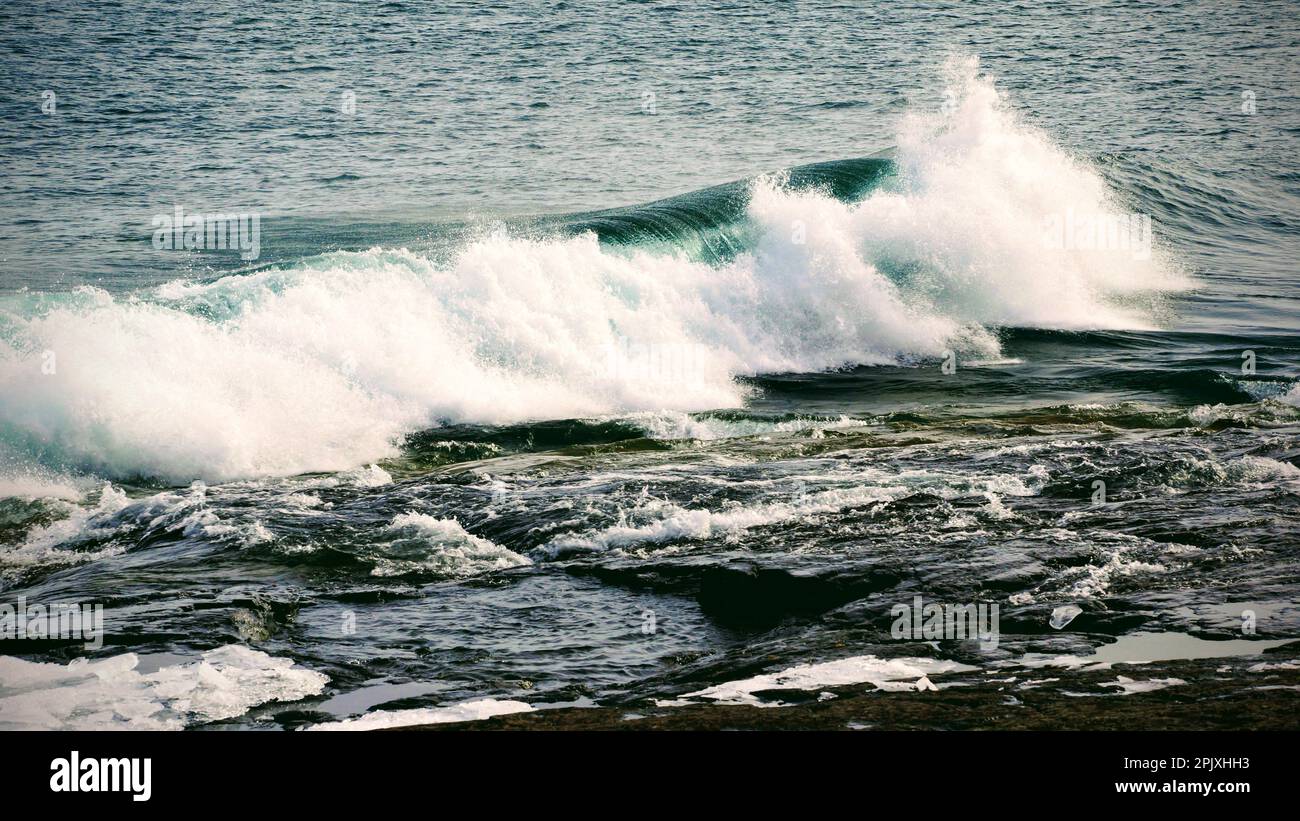 Large Wave in Two Harbors Stock Photo - Alamy