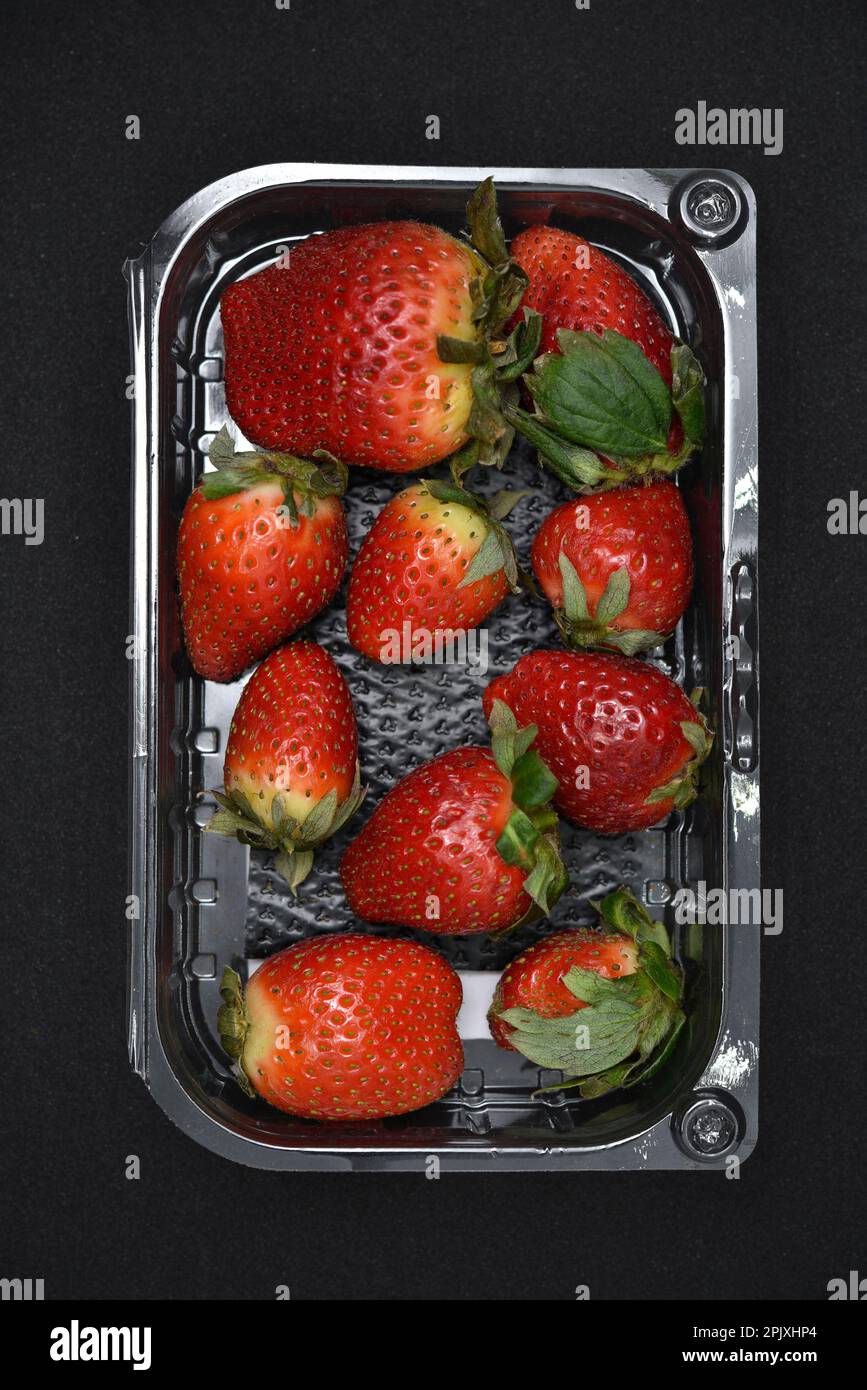 Group of bright red shiny strawberries hi-res stock photography and ...