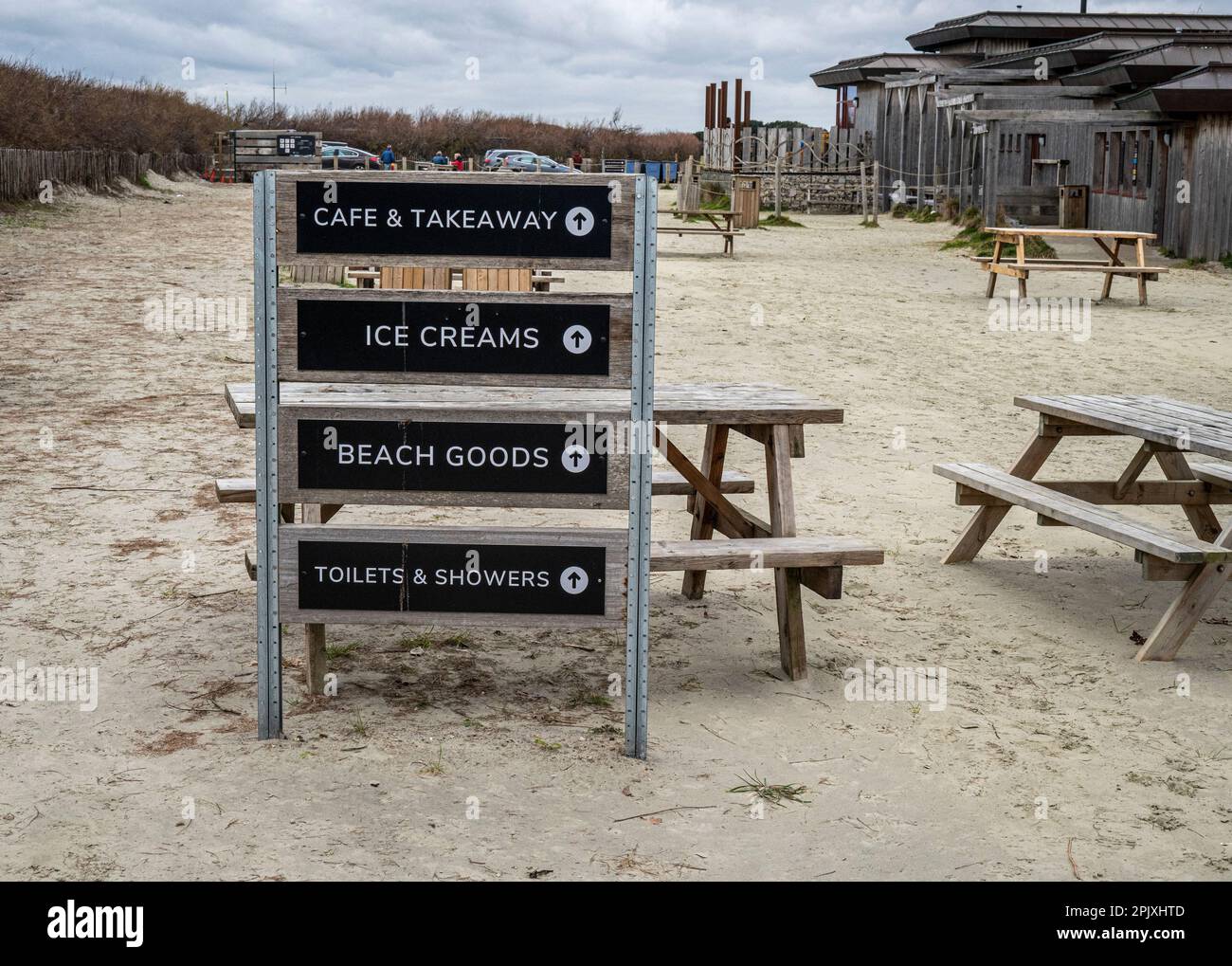 Sign for beach cafe planted in the sand at West Wittering, Sussex, UK ...