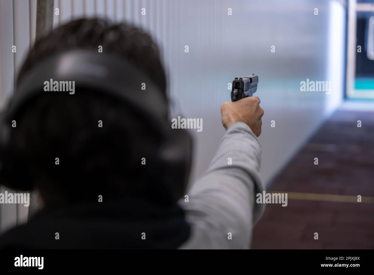 Man shooting a long gun hi-res stock photography and images - Alamy