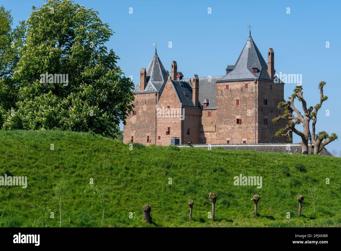 Captivating view over the dike to Slot Loevestein Castle and its rich ...