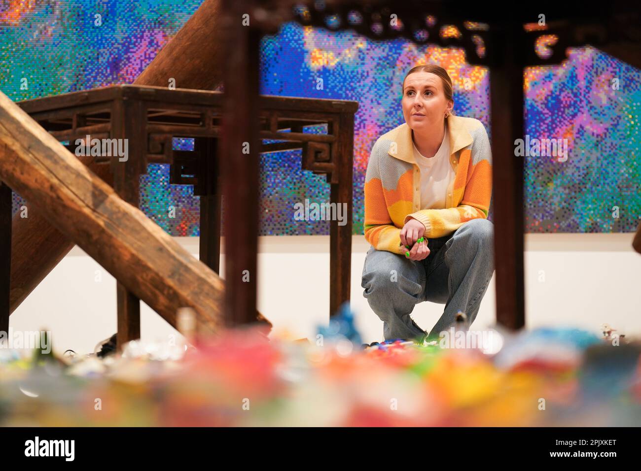 A model looks at Ai Weiwei's, Untitled (Lego Incident) during a photo ...