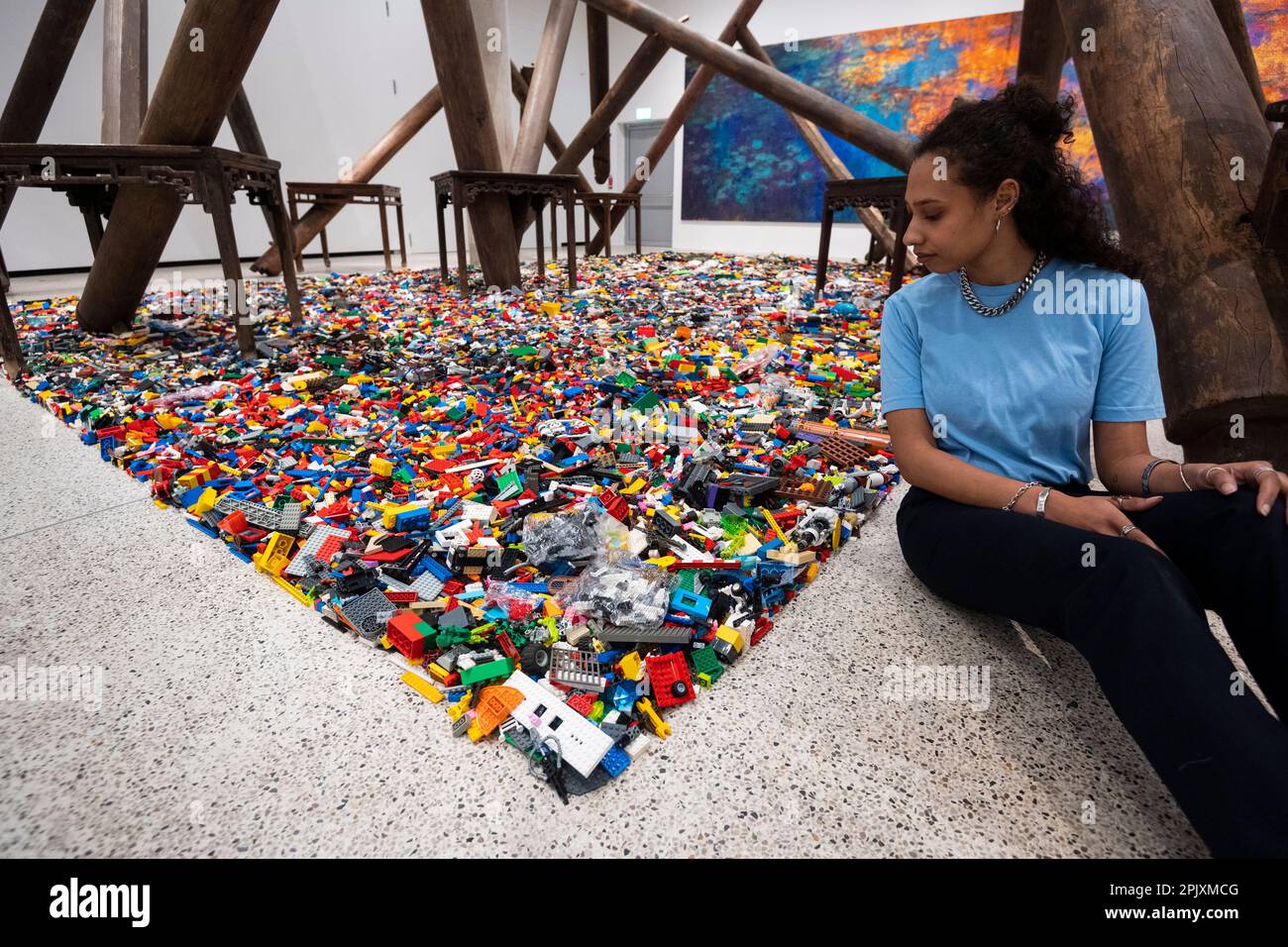 London, UK. 4 April 2023. A staff member next to 'Untitled (Lego ...