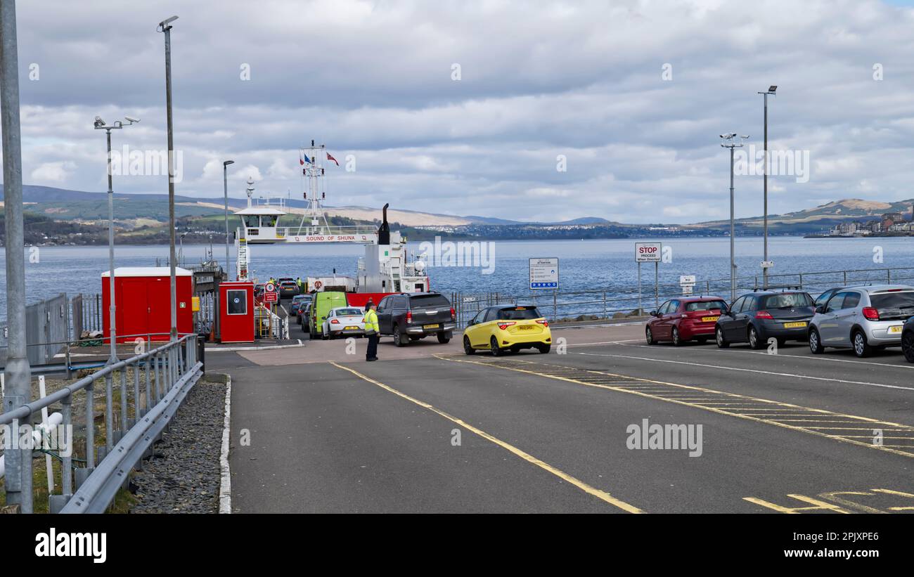 cars load on to Western 'Red' Ferries 'Sound of Shuna' at the terminal ...