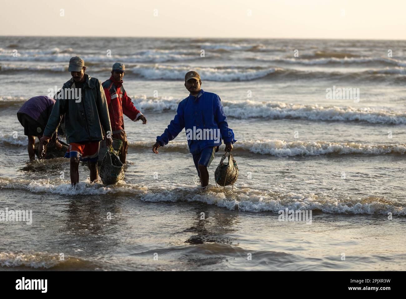 karachi pakistan 2021, a group of fisherman doing fishing at sea view ...