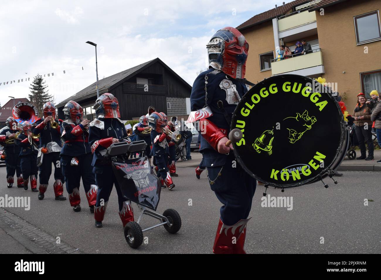 A marching band wearing costumes parading during a traditional fool's ...