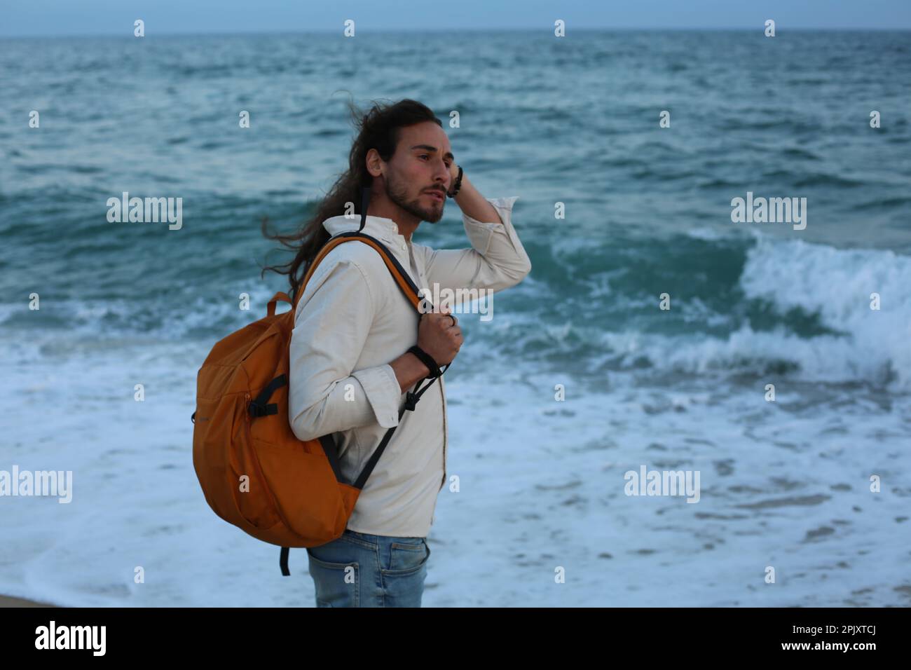 Man on ocean beach hi-res stock photography and images - Alamy
