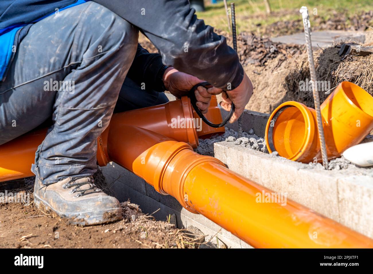 PVC plastic pipe for sewerage in the ground Stock Photo - Alamy