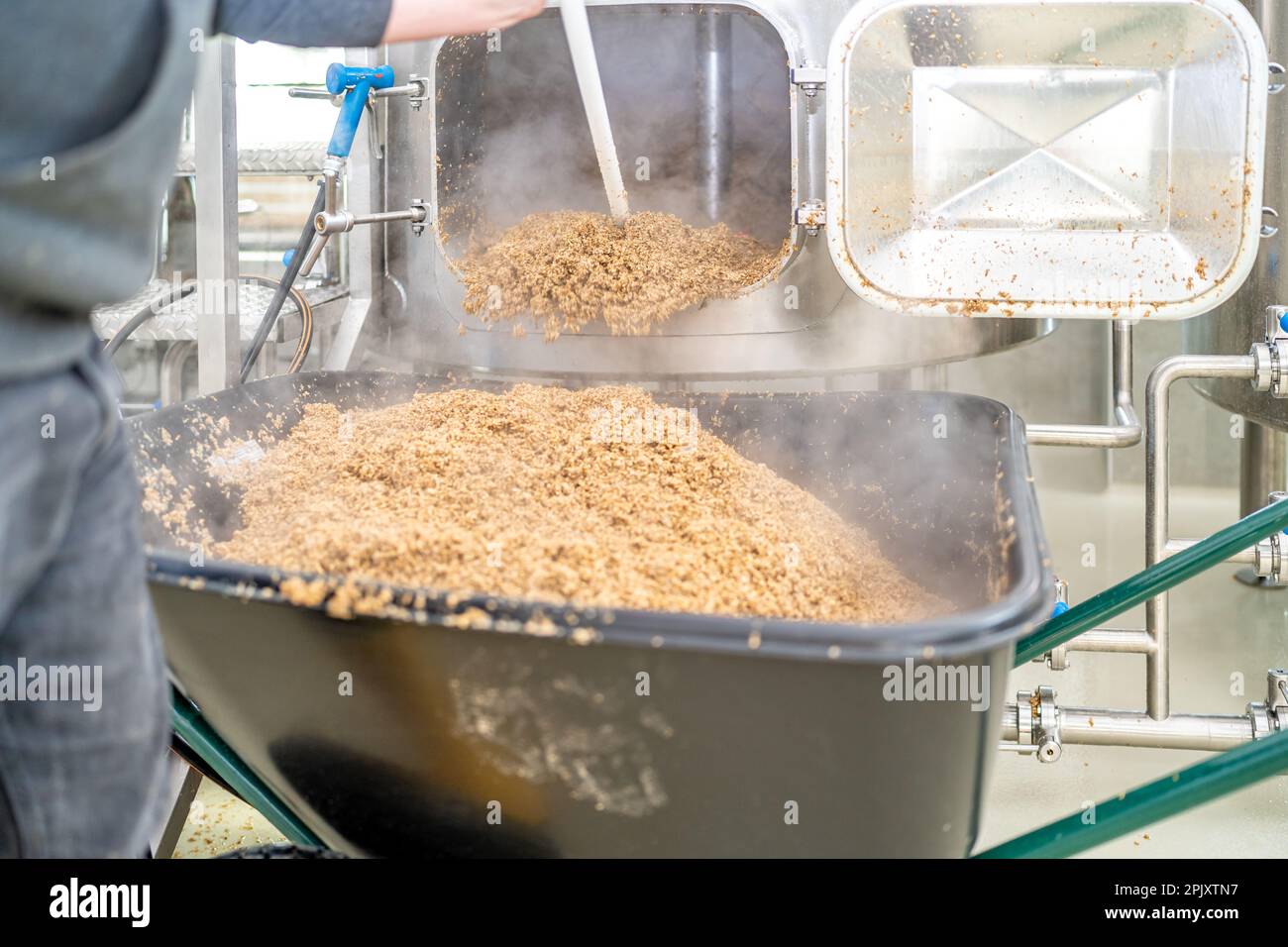 cleaning the boiler from residual malt after brewing beer in the ...